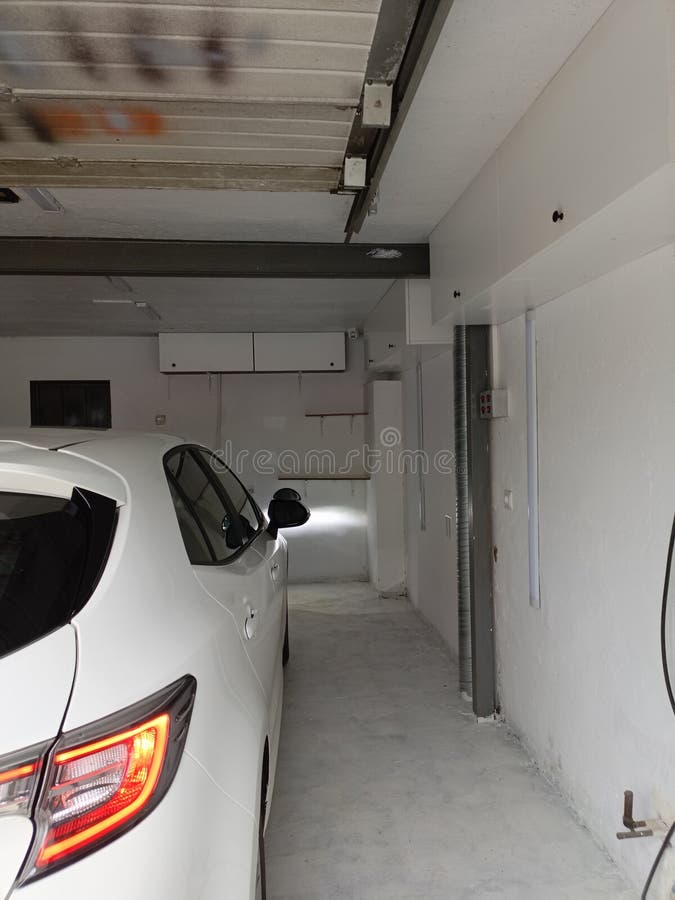 White Passenger Car Stands in the Garage Stock Image - Image of hatchback, machine: 319436647