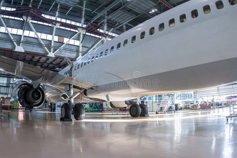 White Passenger Jet Plane in the Aviation Hangar. Jetliner Under ...
