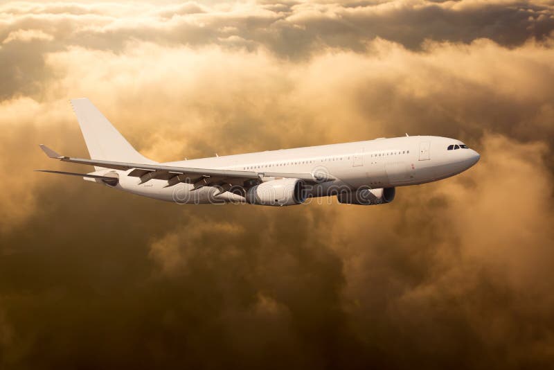 White Passenger Plane in Flight. Aircraft Fly High Above the Golden ...