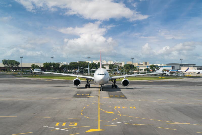 White Passenger Plane Takes Off from the Airport Runway. Airplane Front ...