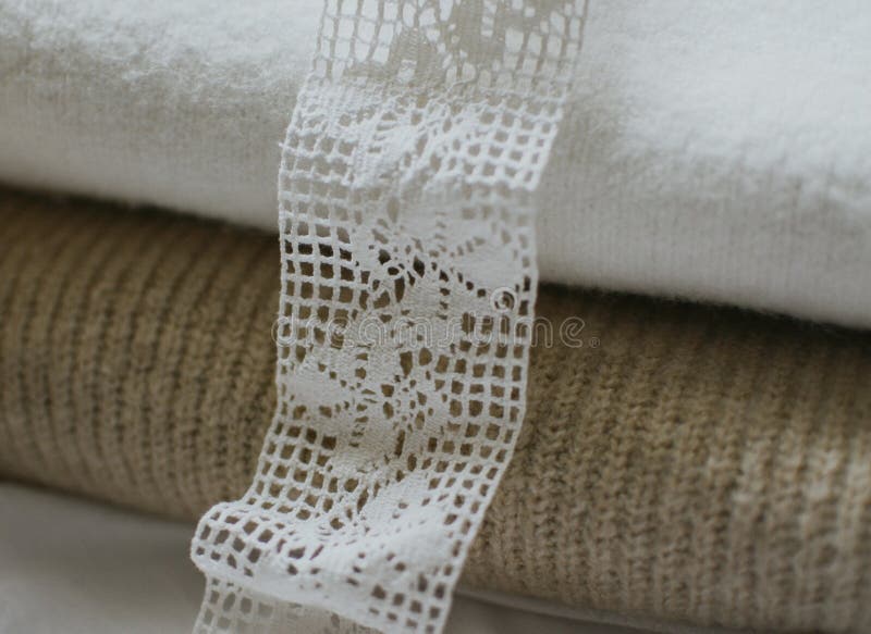 White Patterned Fabric Ribbon on a Background of Delicate Colors of ...