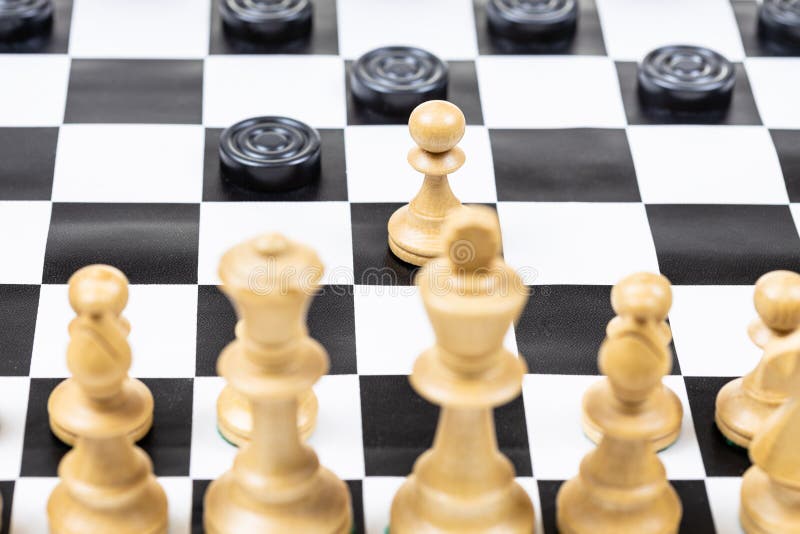 White Pawn and Black Checkers Disc Moves Closeup Stock Image - Image of ...