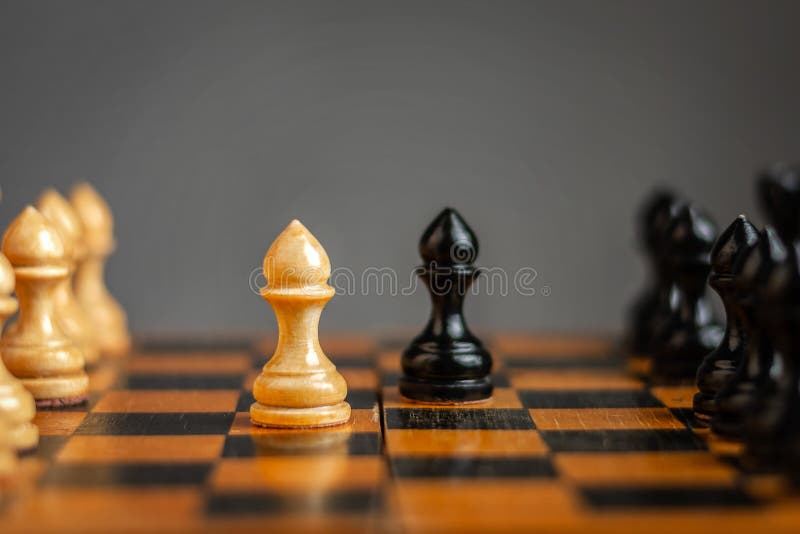 White Pawn, in Front of Black, on a Chessboard. Selective Focus ...