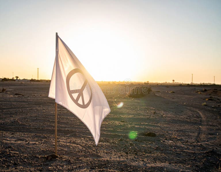 A White Peace Flag Planted on a Desolate, Empty Battlefield at Sunrise ...