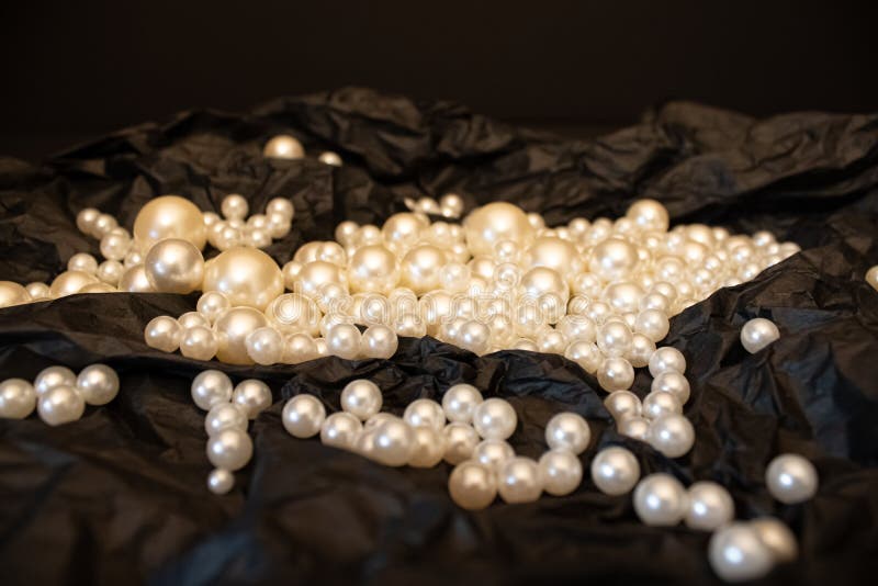 White Pearls on the Black Stylish Background. Stock Photo - Image of ...