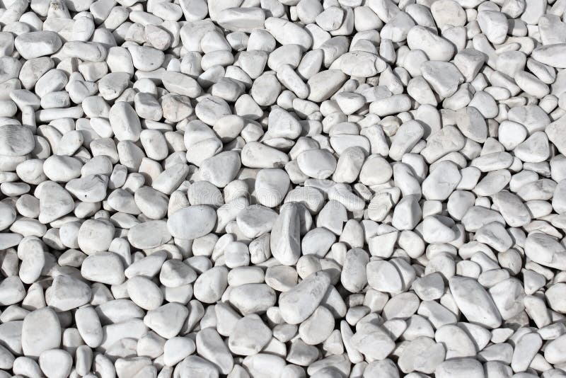 White pebbles on a beach stock image. Image of round - 93407507