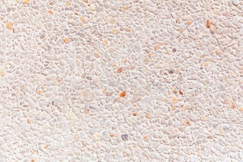 White Pebbles in the Plaster Wall. Texture Stock Image - Image of ...