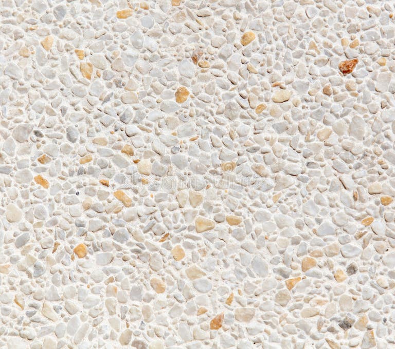 White Pebbles in the Plaster Wall. Texture Stock Image - Image of ...