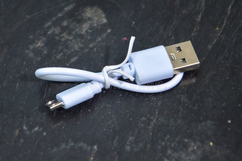 A white phone usb cable stock photo. Image of firearm - 335962838