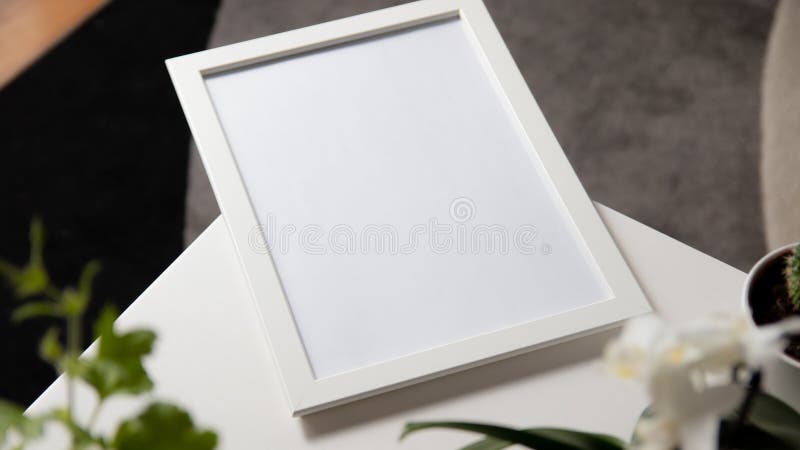 White Photo Frame on the Table. White Blank Photo Frame on the Table ...