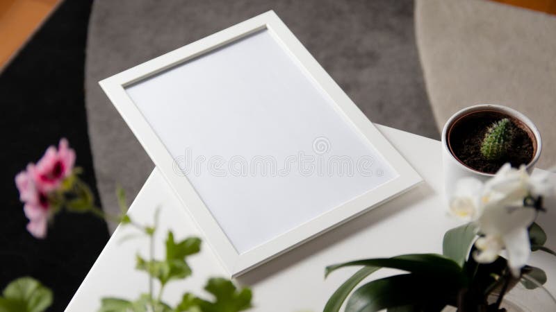 White Photo Frame on the Table. White Blank Photo Frame on the Table ...