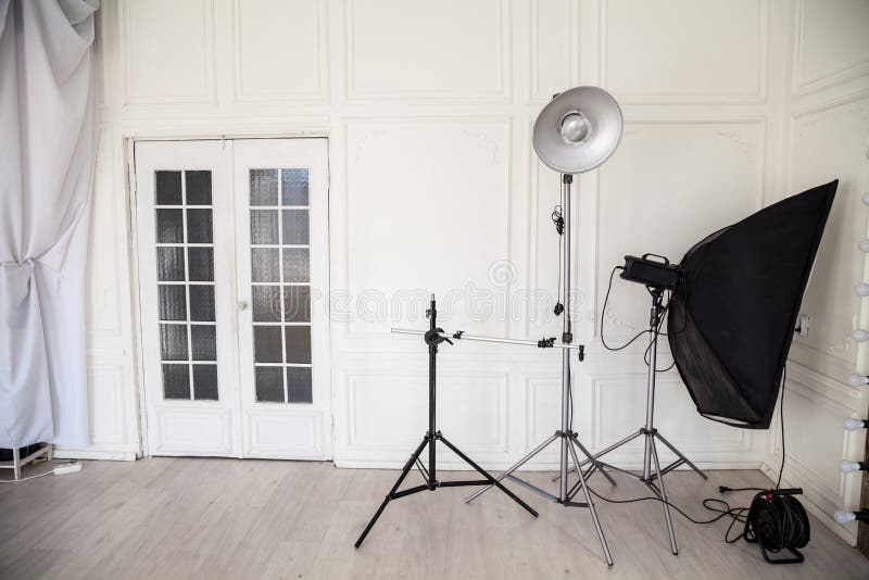 White Photo Studio Interior with Flashes and Racks Stock Image - Image ...