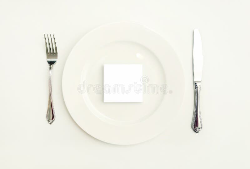White Piece of Paper on Plate on Table Stock Photo - Image of silver ...