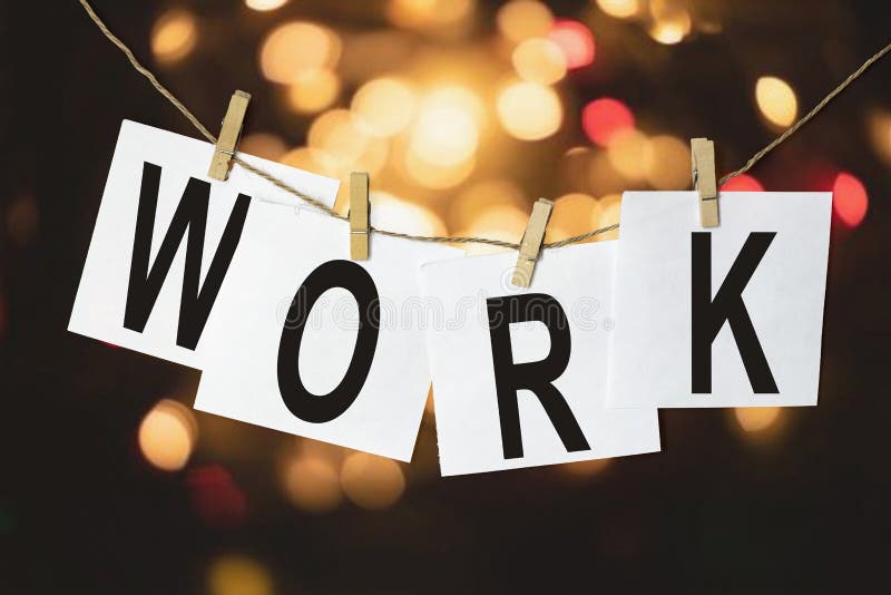 White Pieces of Paper with the Text Work Hang on a Rope Against a ...