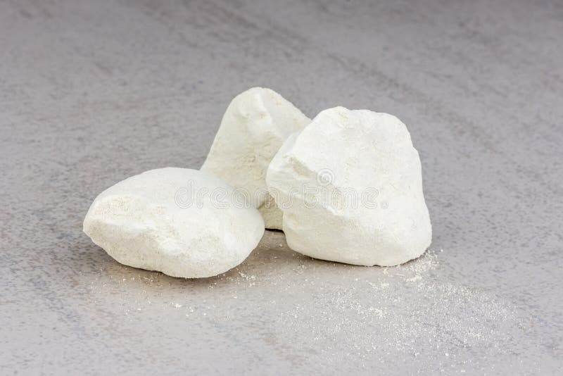White Pieces of Quicklime Close-up on a Gray Background. Stock Image ...
