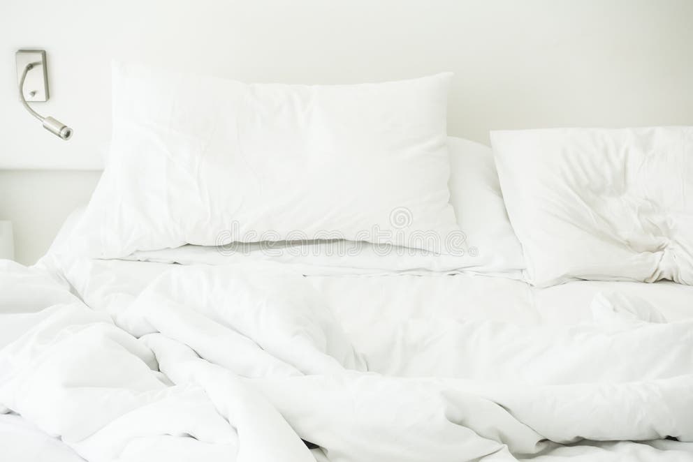 White Pillow on Rumpled Bed Stock Image - Image of rumpled, indoors ...