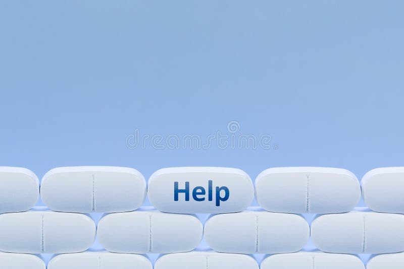White Pills on a Blue Background with the Word `Help` Stock Image ...