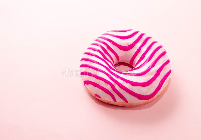 White Pink Half-bitten Donut Close-up on Bright Blue Background Stock ...