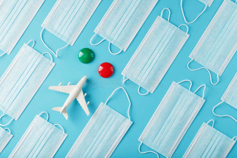 A White Plane Surrounded by Protective Masks on a Blue Background with ...