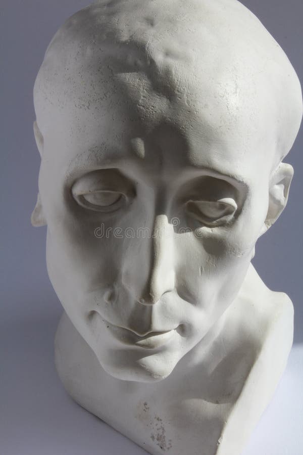 White Plaster Statue of Mans Head on Blue Grey Background Stock Image ...