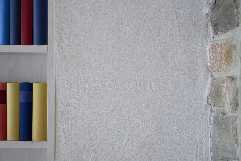 White Plastered Wall in a Loft with Detail of a Bookcase and Stone Wall ...