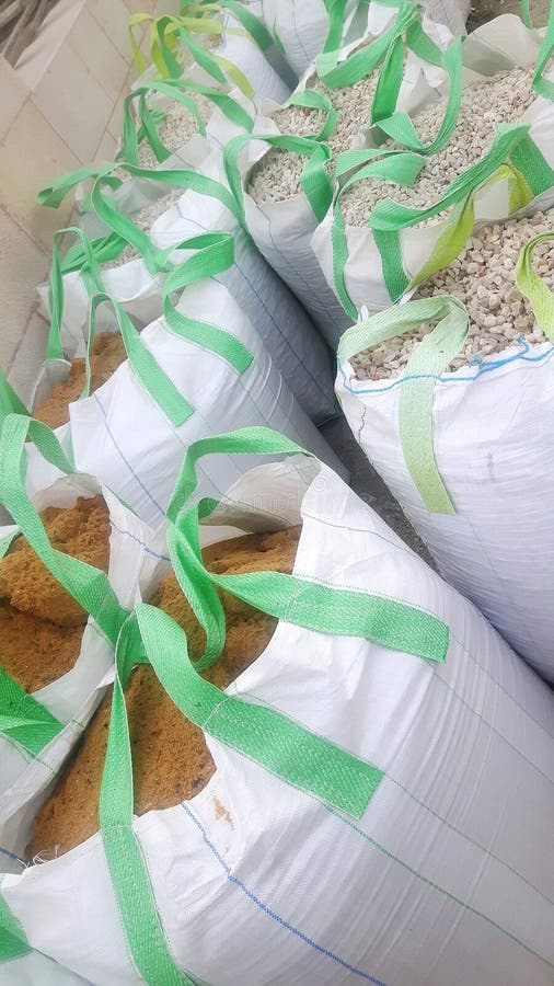 White Plastic Bags at Construction Site Filled with Sand Stock Photo ...