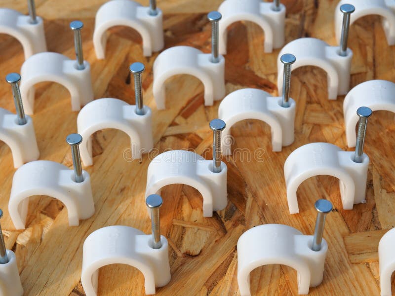 White Plastic Cable Clips with Nails Stock Image - Image of wall, cable ...