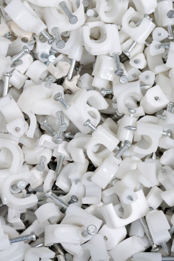 White plastic cable clips. stock image. Image of wire - 30934857