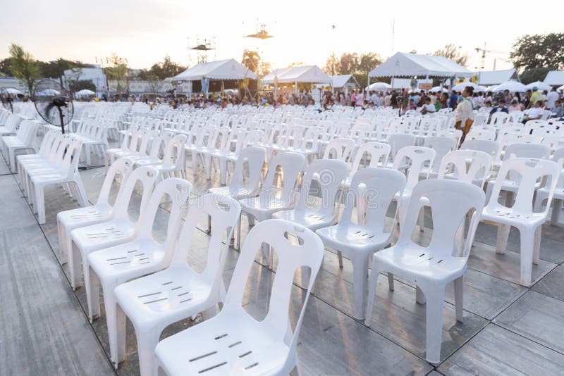 White Plastic Chairs in Rows Celebration and Outdoor Event with Light ...