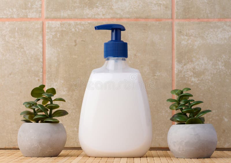 White Plastic Container with a Pump for Liquid Products. Container for ...