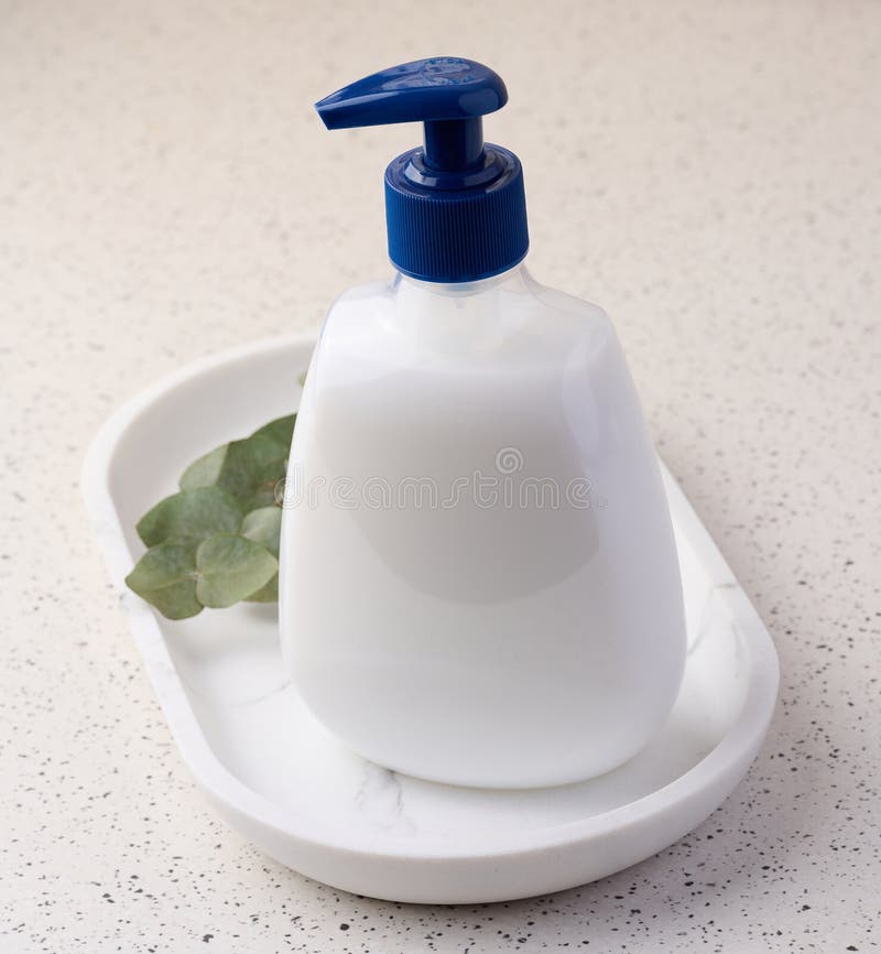 White Plastic Container with a Pump for Liquid Products. Container for ...