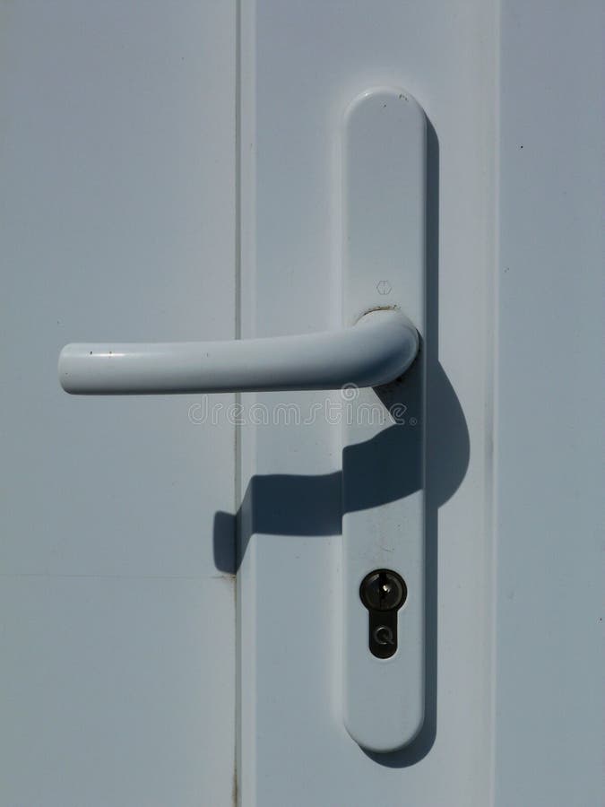 White Plastic Door Handle and Lock and Shadow Stock Photo - Image of ...