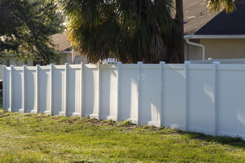 White Plastic Fence for Back Yard Protection and Privacy Stock Photo ...