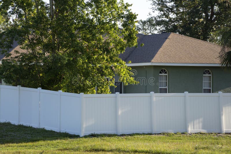 White Plastic Fence for Back Yard Protection and Privacy Stock Photo ...