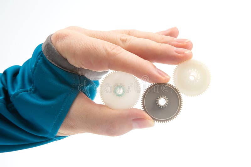 White Plastic Gears in Hand. Machine Motion Transmission Mechanism ...