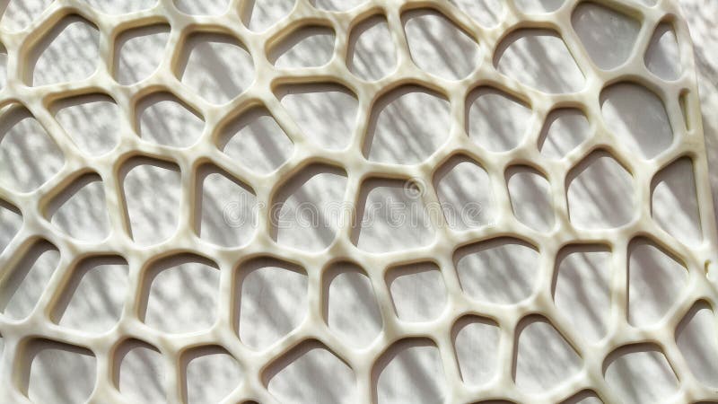 White Plastic Grid Cells Illuminated by the Sun with Shadows. Abstract ...