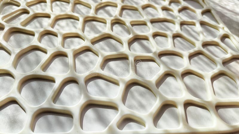 White Plastic Grid Cells Illuminated by the Sun with Shadows. Abstract ...