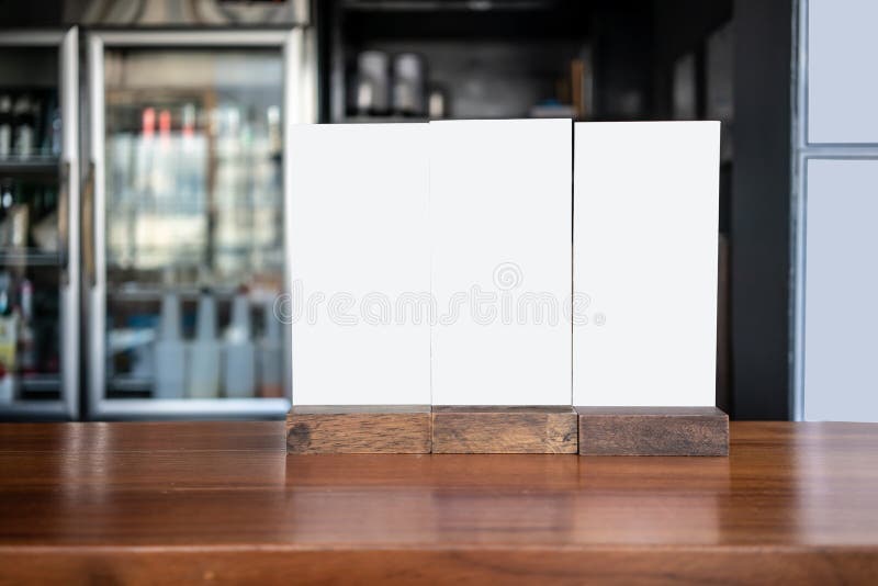 White Plastic Menu Board on Wooden Counter Table in Front of Kitchen ...