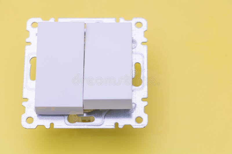 White Plastic Modern Light Switch on a Yellow Background Stock Image ...