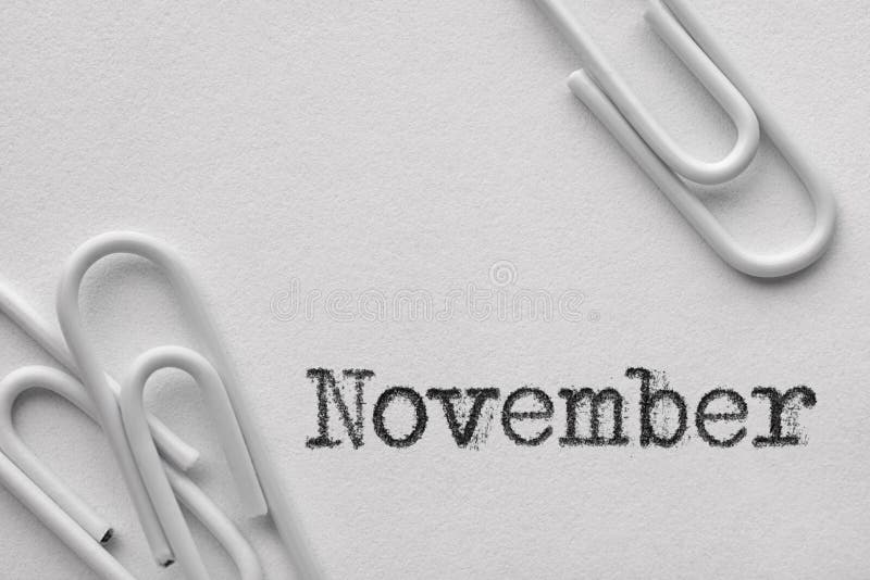 White Plastic Paper Clips with November Word Stock Photo - Image of ...