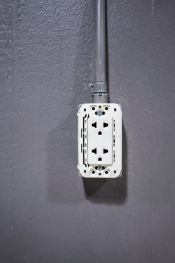 White Plastic Plug Socket Connected with Silver Metal Pipe in Vertical ...