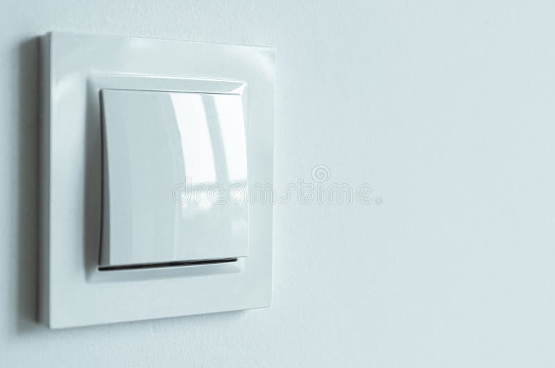 A White Plastic Power Switch in an Apartment on a White Wall Stock ...