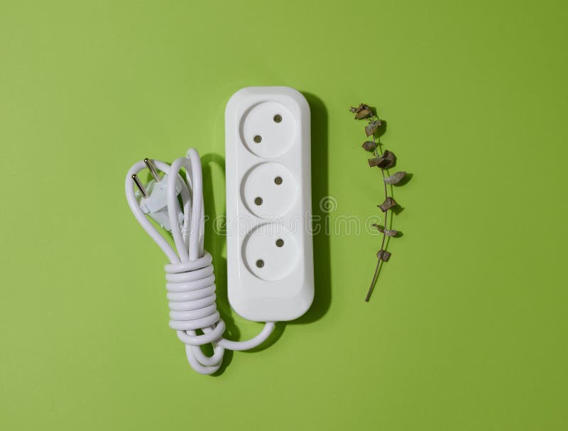 White Plastic Socket with Cable on a Green Background, Top View Stock ...