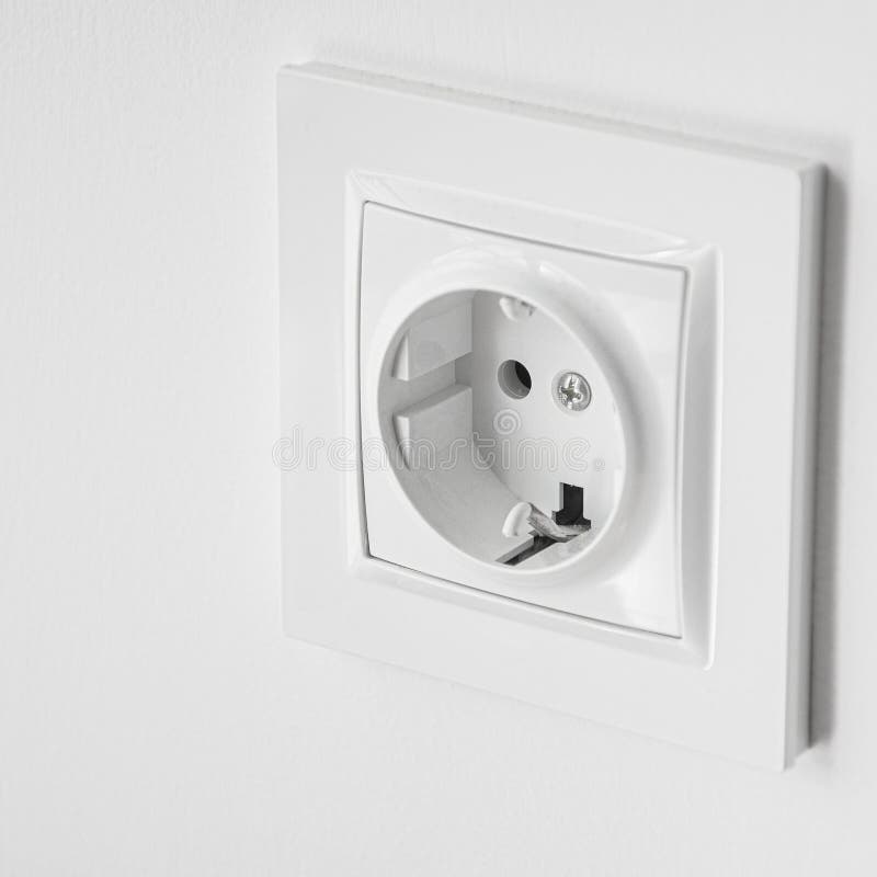 The White Plastic Socket is Mounted in a White Wall Stock Image - Image ...