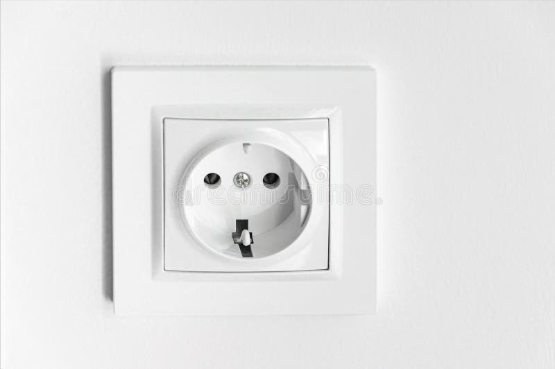 The White Plastic Socket is Mounted in a White Wall Stock Photo - Image ...