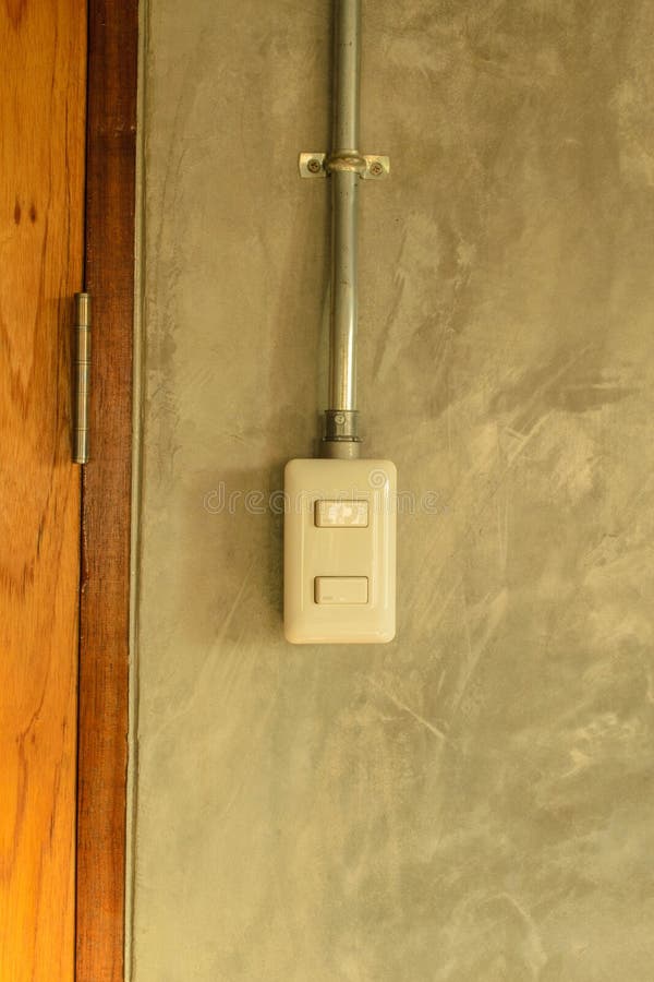 White Plastic Switch Panel is on Loft Style Wall Stock Photo - Image of ...