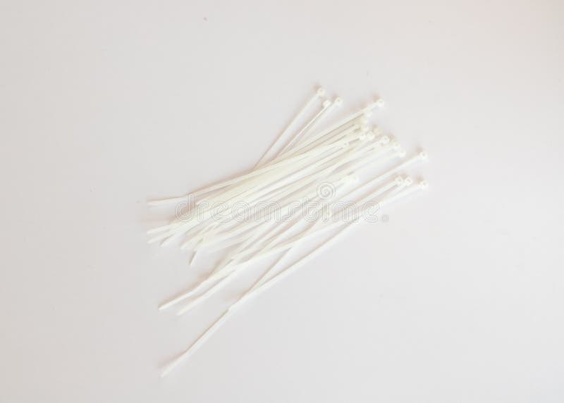 White Plastic Ties on White Isolated Background Stock Photo - Image of ...