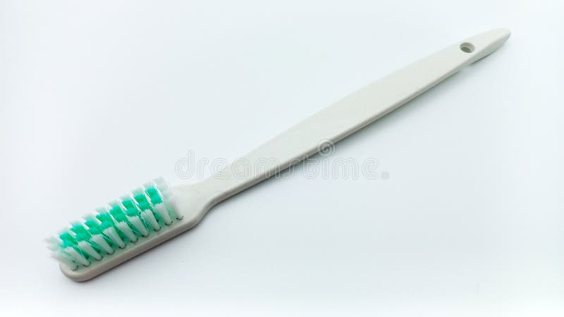 White Plastic Toothbrush Isolated on White Background. Tilted View from ...
