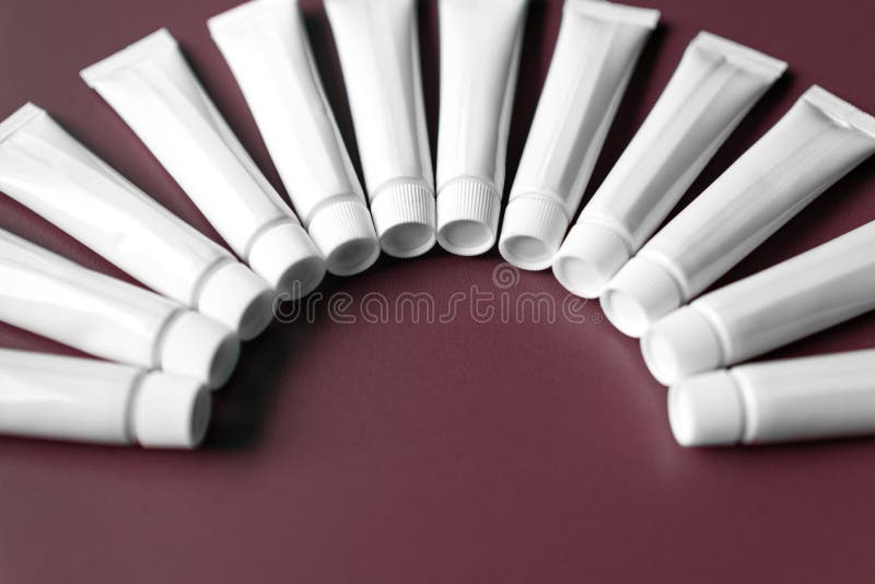 White Plastic Tubes with Dark Background Stock Photo - Image of graphic ...