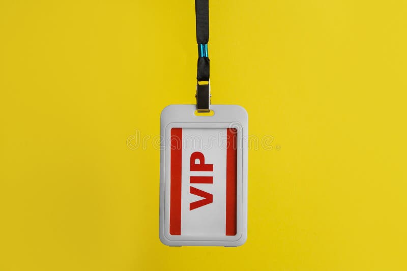White Plastic Vip Badge Hanging on Yellow Background Stock Photo ...